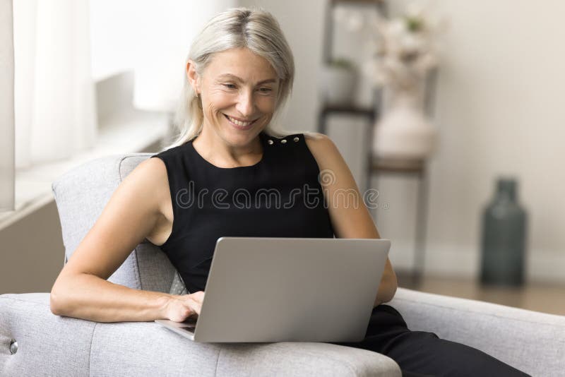 Happy Positive Mature Woman Using Online Application Software Stock ...