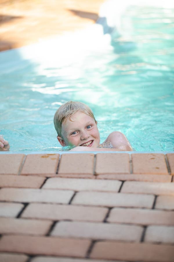 Happy Pre-teen Boy Swimming in Backyard Pool Stock Image - Image of ...
