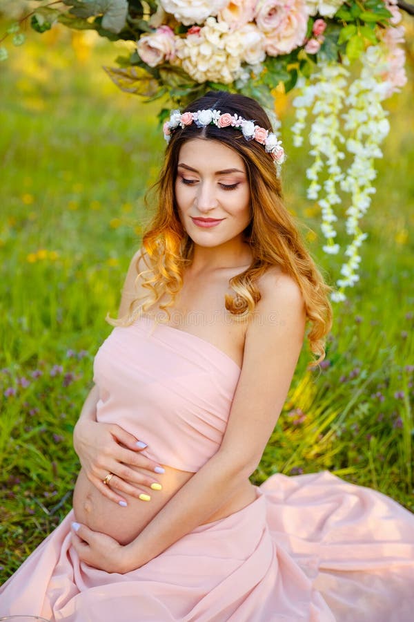 Happy Pregnant Woman Relaxing Outside In The Park Outdoor Stock Image