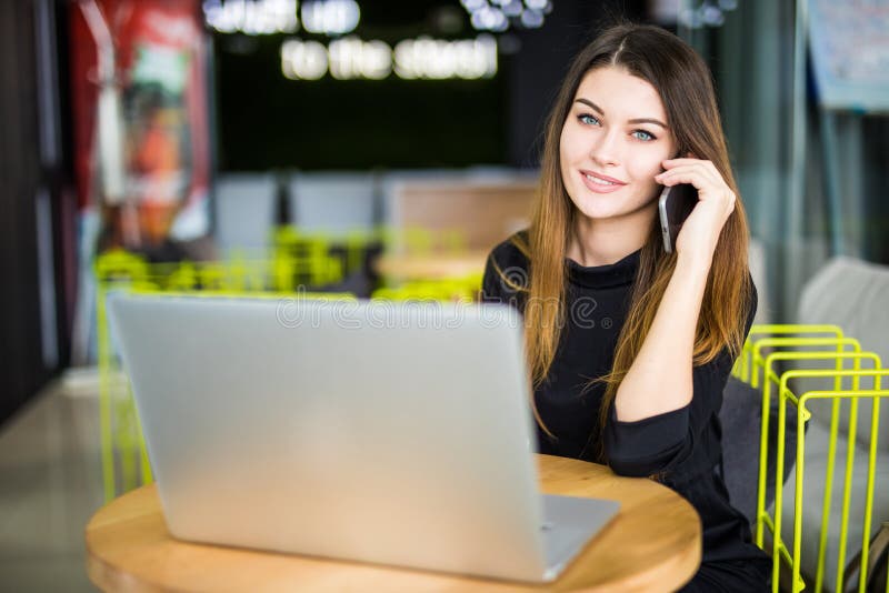 Happy Pretty Manager Talking on Mobile Phone with Client in Modern ...