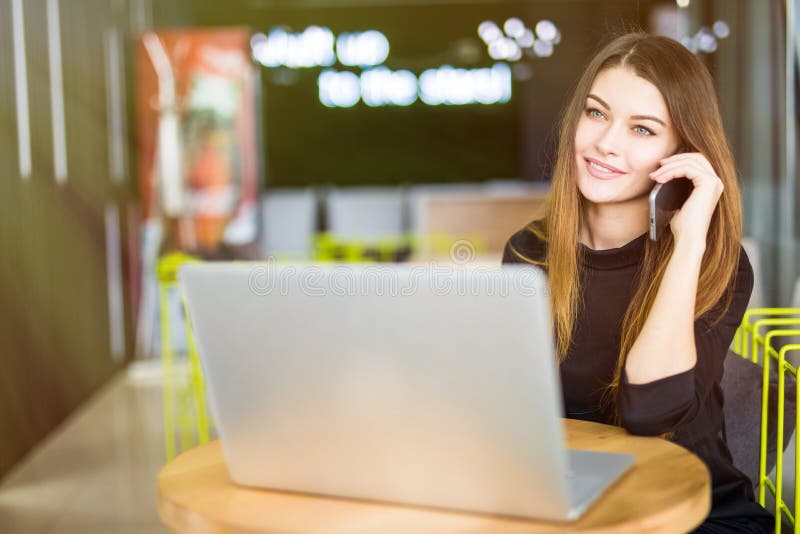 Happy Pretty Manager Talking on Mobile Phone with Client in Modern ...