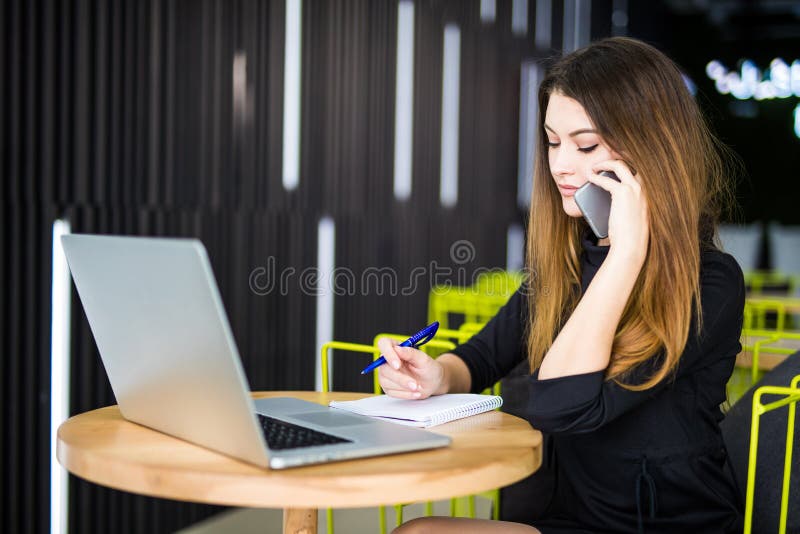 Happy Pretty Manager Talking on Mobile Phone with Client and Write ...