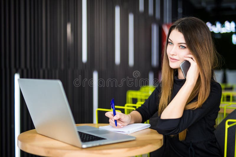 Happy Pretty Manager Talking on Mobile Phone with Client and Write ...