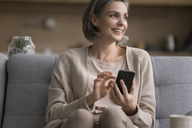 Happy Pretty Middle Aged Woman Holding Mobile Phone, Using Application ...