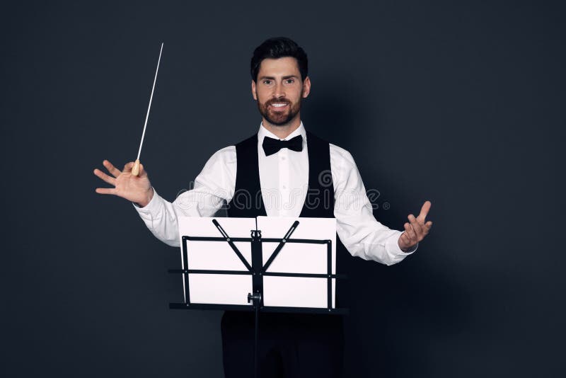 Happy Professional Conductor with Baton and Note Stand on Grey ...