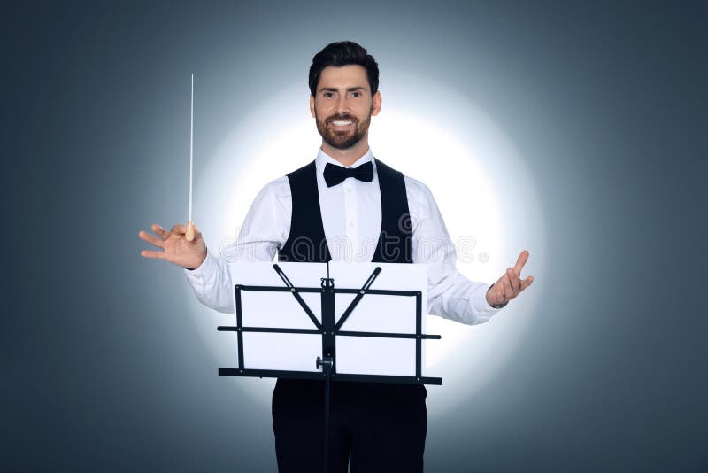 Happy Professional Conductor with Baton and Note Stand on Grey ...