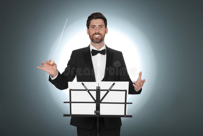 Happy Professional Conductor with Baton and Note Stand on Grey ...