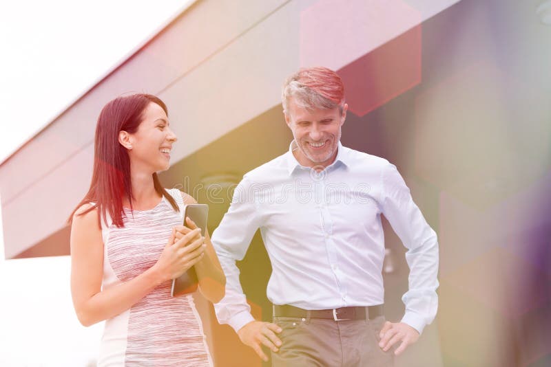 Happy Professionals Discussing at Office Terrace Stock Image - Image of ...