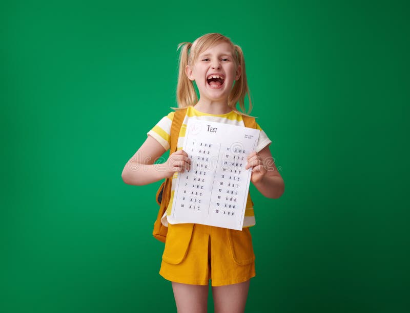 Happy Pupil Holding Excellent Grade Test Isolated on Green Stock Photo ...