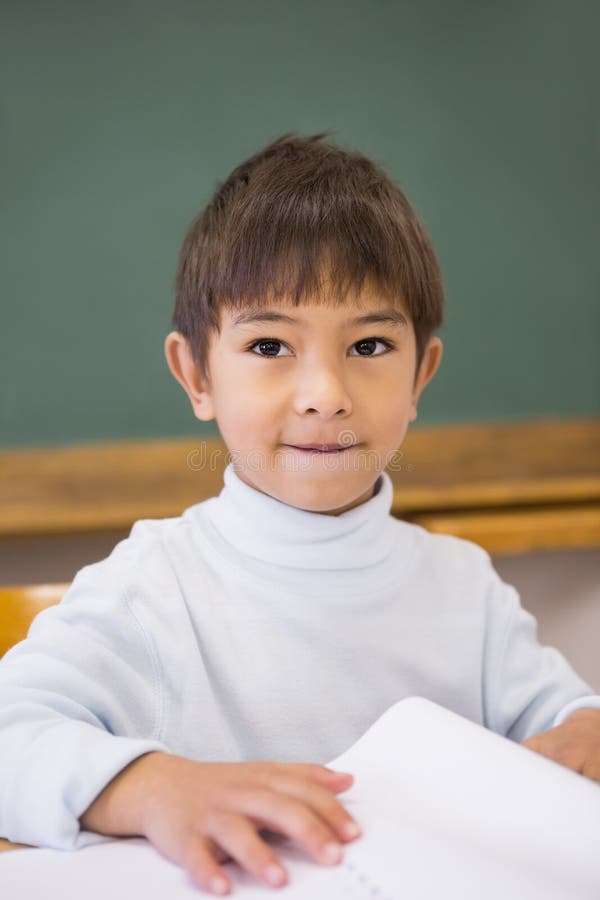 Happy Pupil Sitting at Desk in Classroom Stock Image - Image of asian ...