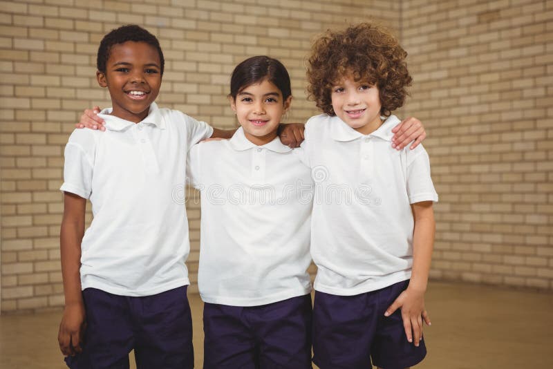 Happy Pupils Reading a Library Book Stock Photo - Image of development ...