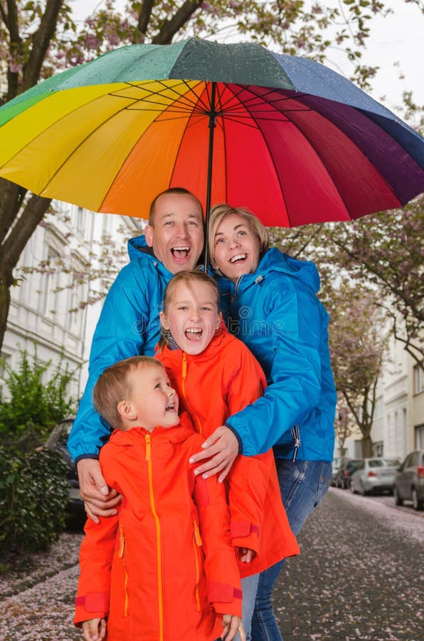 Happy Rain Family Under Colorful Umbrella Stock Photo - Image of ...