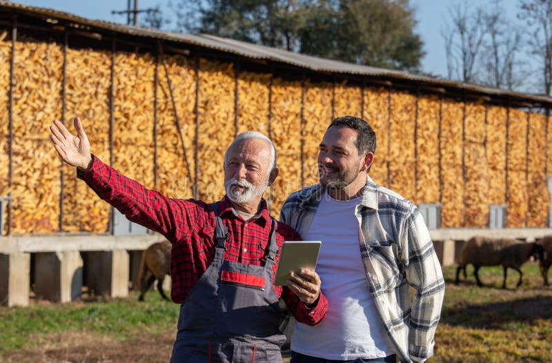 Happy Ranchers Using Touchpad on a Farm Stock Image - Image of computer ...