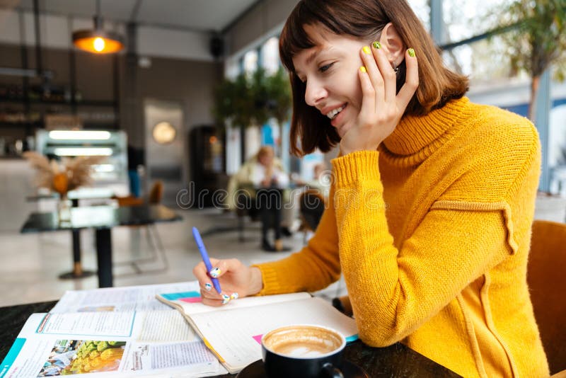 Happy Student Girl Drinking Coffee and Doing Homework in Cafe Stock ...