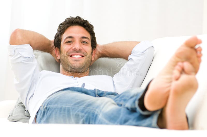 Man relaxing on sofa stock photo. Image of fresh, indoor - 24317882