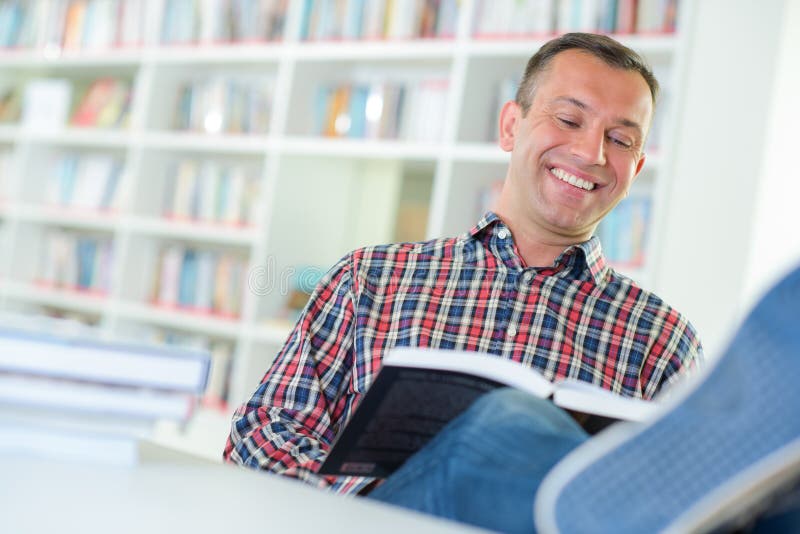 Happy and relaxed reader stock photo. Image of reader - 121668932