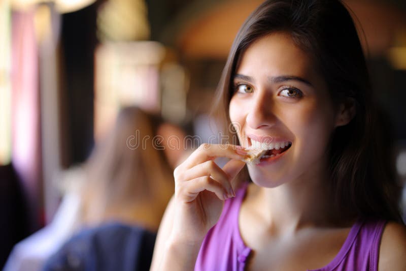 Happy Restaurant Customer Eating Bread Looking at You Stock Photo ...