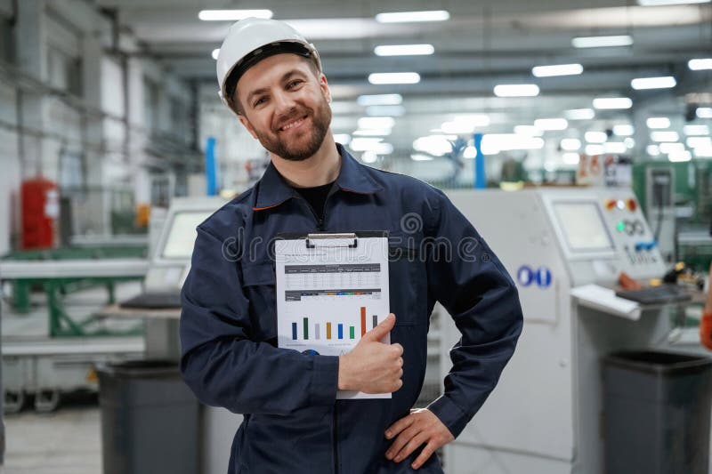 Happy Results Holding Graphs Factory Worker Indoors Hard Hat Stock ...