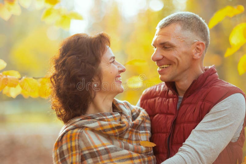 Hello Autumn. Happy Couple in the Park Hugging Stock Image - Image of ...