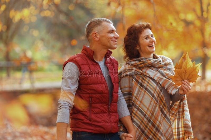 Happy Romantic Family in Park with Autumn Leafs Walking Stock Image ...