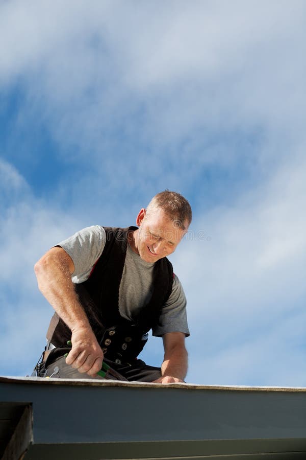 Roofer Working on Exterior stock image. Image of site - 16295597