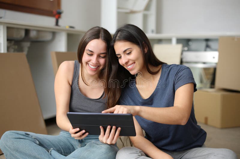 Happy Roommates Checking Tablet Reforming House Stock Photo - Image of ...