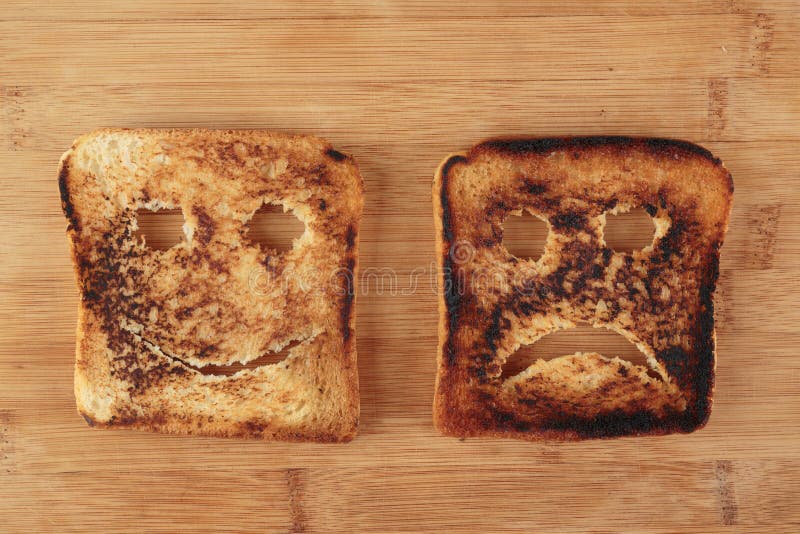 Happy and Sad Toast on a Cutting Board Stock Photo - Image of food ...