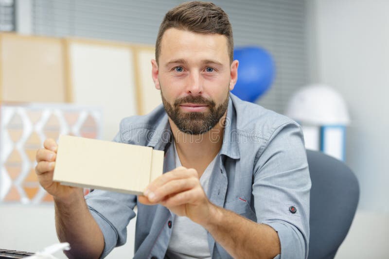 Happy Sales Man Showing Wood Samples in Office Stock Photo - Image of ...