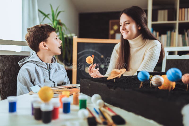 School Boy and Girl Making a Solar System for a School Science Project ...