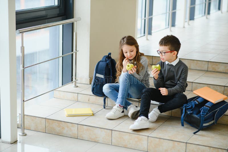 Happy School Kids in Corridor at School. Stock Photo - Image of pupil, community: 265904690