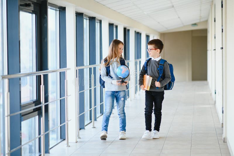 Happy School Kids in Corridor at School. Learning Concept. Stock Photo ...