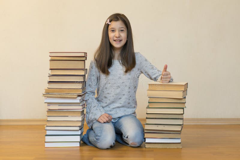 Happy Schoolgirl with Books in the Room Stock Photo - Image of looking ...