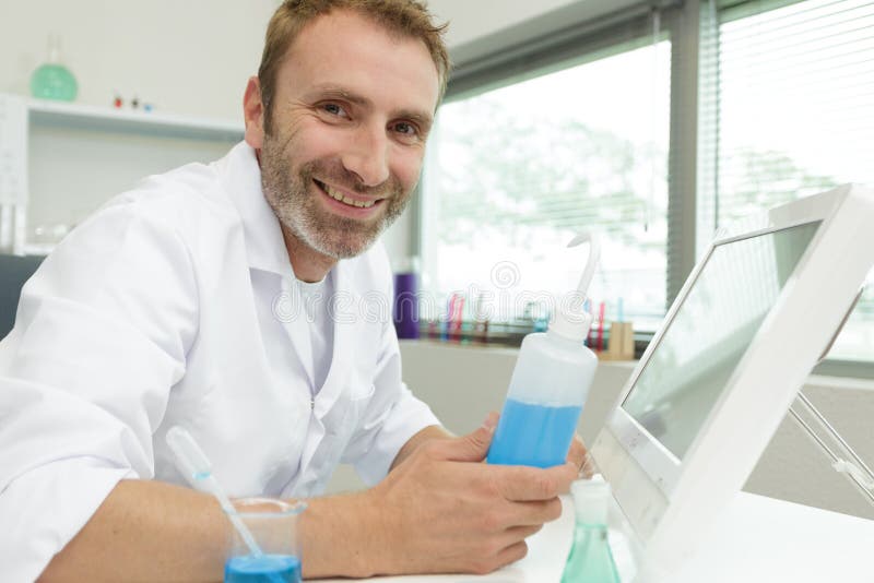 Happy Scientist Smiling at Camera in Laboratory Stock Photo - Image of ...