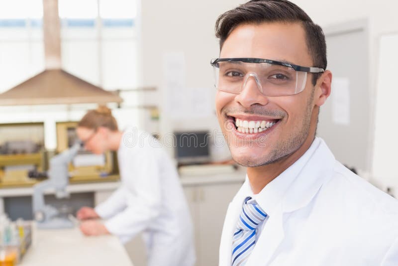 Happy Scientist Smiling at Camera Stock Photo - Image of coat ...