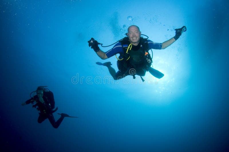 Happy Scuba Diver Beginning a Dive Stock Image - Image of divers ...