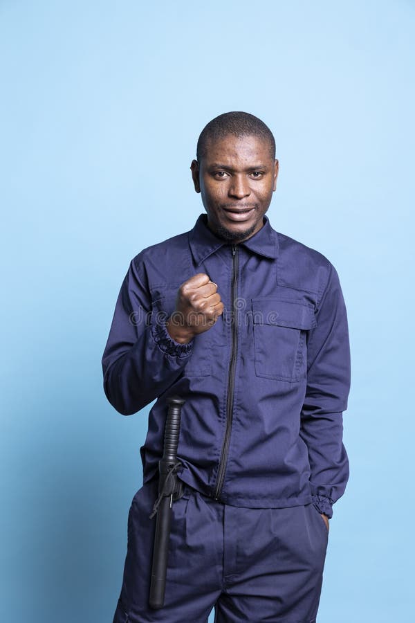 Happy Security Guard Cheering about Something in Studio Stock Photo ...