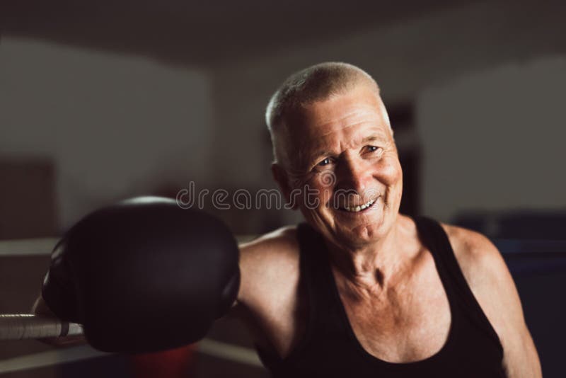 Happy Senior Boxer Man with Black Gloves in the Ring Stock Image ...