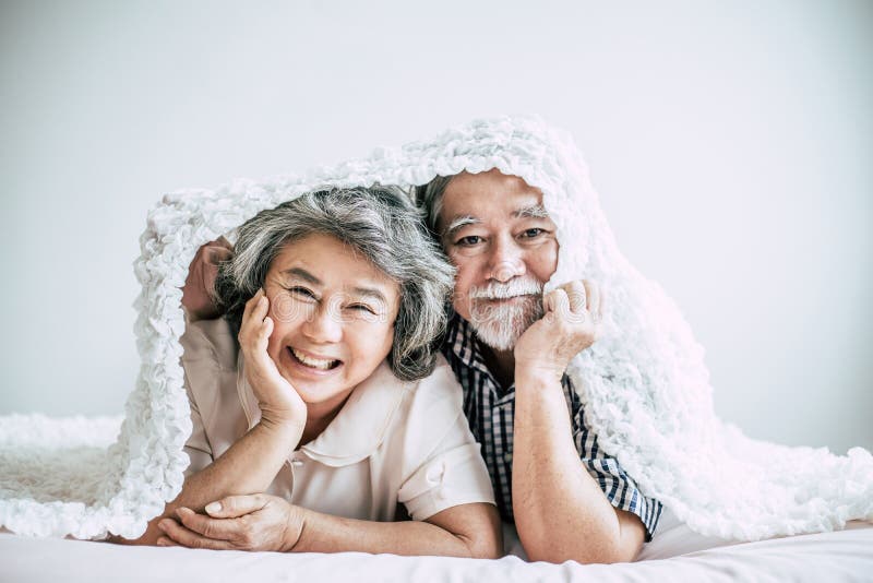 Happy Senior Couple in Bedroom Stock Image - Image of older, couple ...