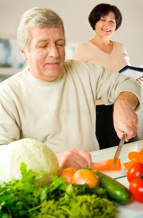 Cooking couple at kitchen stock image. Image of lifestyle - 3424083