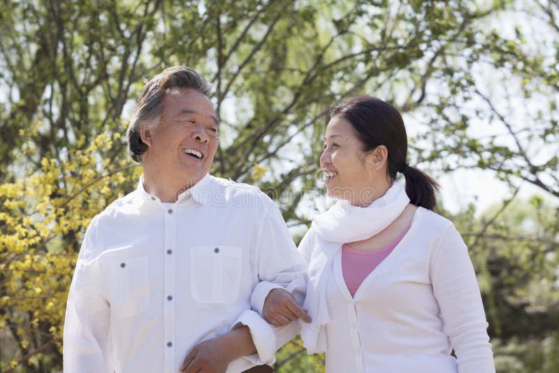 Happy Senior Couple Holding Hands Going Walk Park Springtime Beijing