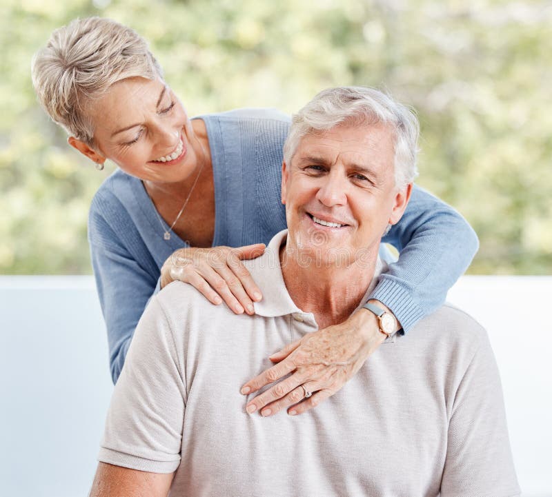 Happy Senior Couple Hug In Home House And Apartment While Relaxing In