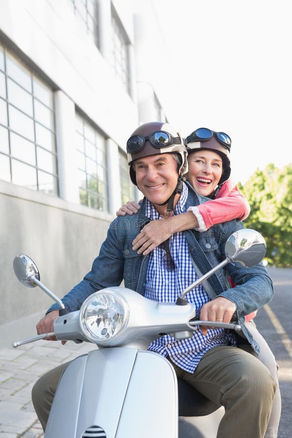 Woman Riding Moped Stock Photos - Download 632 Royalty Free Photos