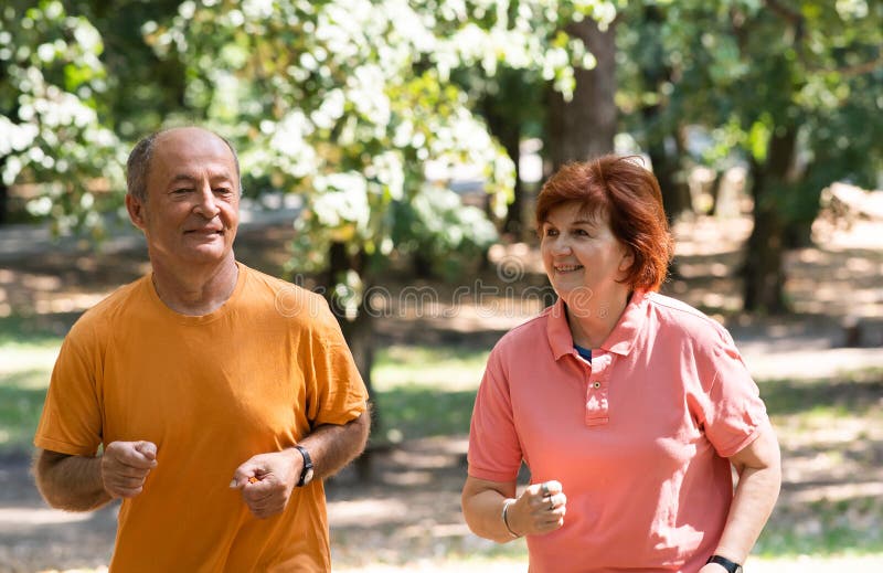 Happy Senior Couple Running Together Stock Image - Image of couple ...