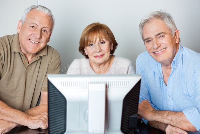 Happy Senior Friends Using Computer in Class Stock Image - Image of ...