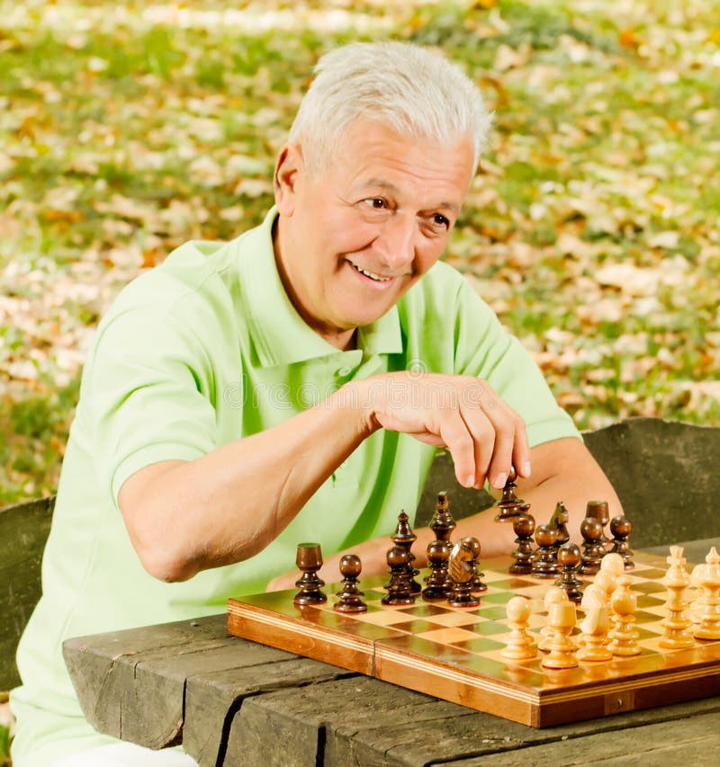Happy Senior Man Playing Chess Stock Photo - Image of life, play: 37845804