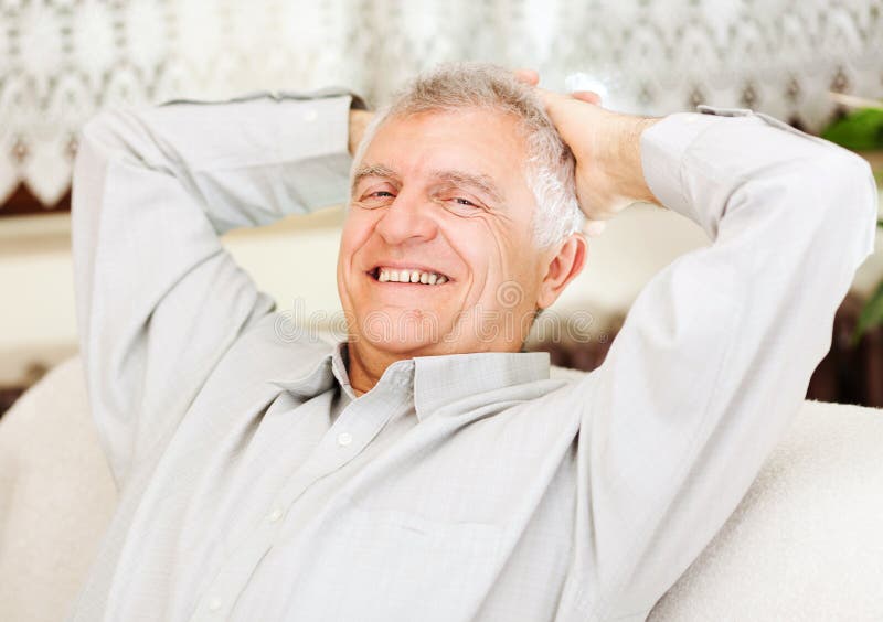 Happy Senior Man Relaxing at Home Stock Photo - Image of adult, smiley ...