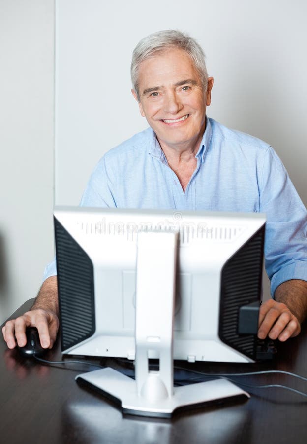 Happy Senior Man Using Computer in Class Stock Photo - Image of ...