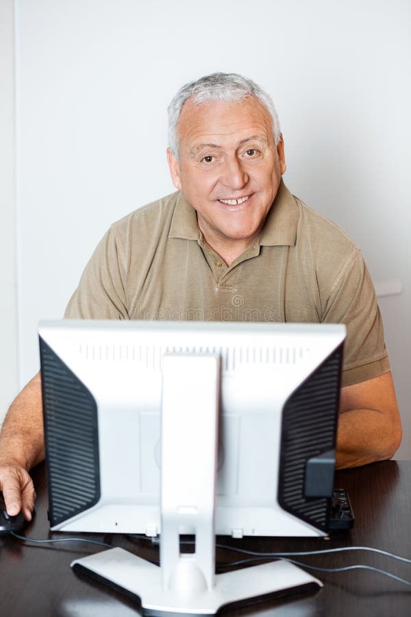 Happy Senior Man Using Computer in Classroom Stock Image - Image of ...