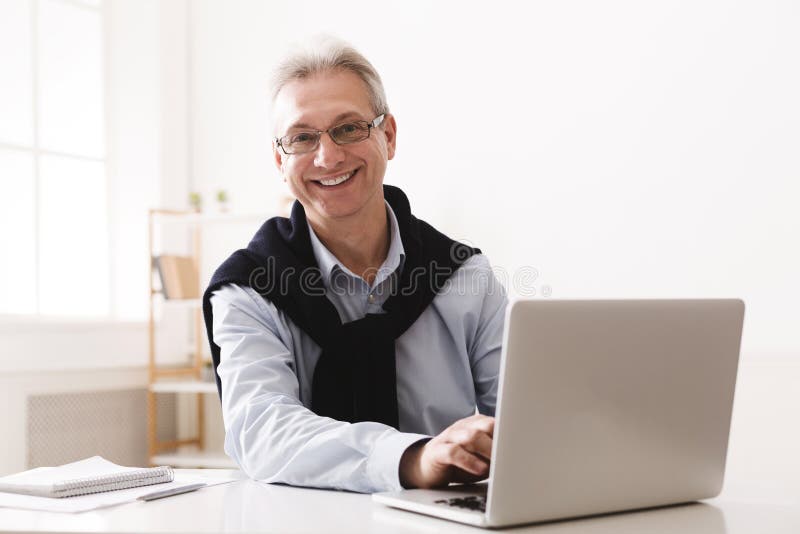 Senior Man Using Computer and Looking at Camera Stock Image - Image of ...