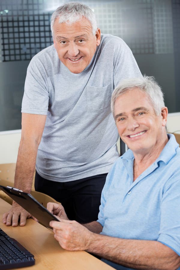 Happy Senior Men with Clipboard in Computer Class Stock Image - Image ...